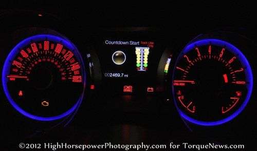 The gauge cluster of the 2013 Ford Mustang GT Premium Coupe in the dark ...